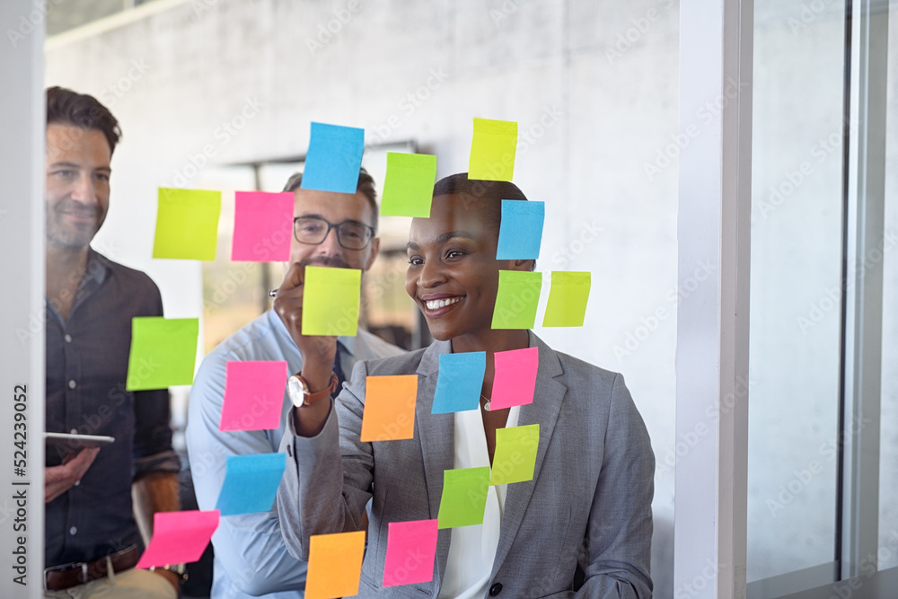 Business people using post it notes to share ideas Stock Photo | Adobe ...