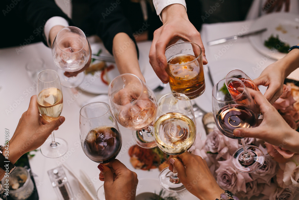 Cheers! Group of people cheering with champagne flutes with home ...