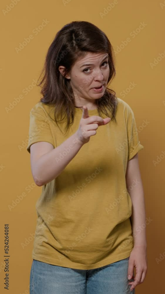 Angry upset woman arguing showing index finger pointing at guilty ...