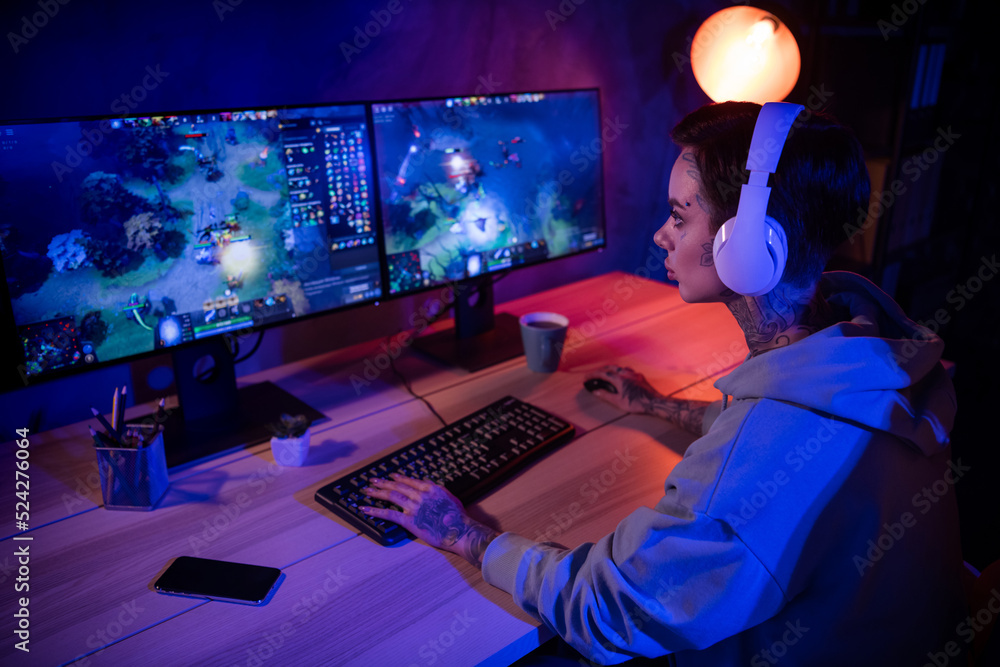 Profile photo of focused girl sitting chair playing video games dark ...