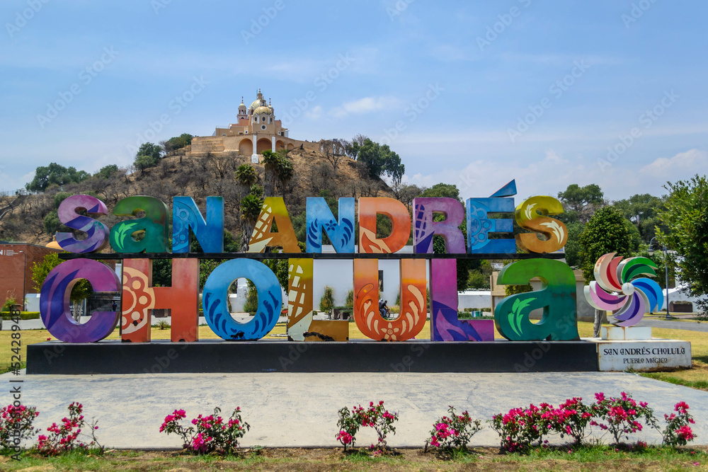 Foto de Colorful Sign for San Andres de Cholula in front of the Giant ...