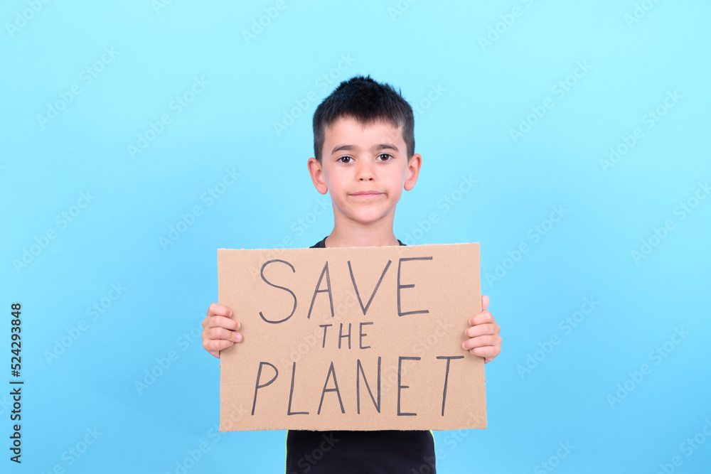 child with poster to save the planet. children against pollution ...
