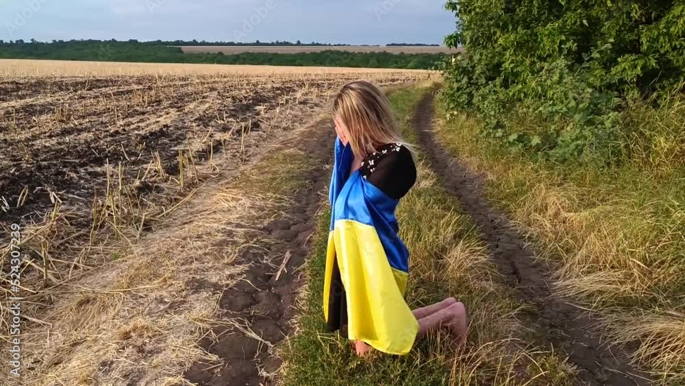 Prayer for Ukraine. Praying Ukrainian girl. A girl with the Ukrainian ...