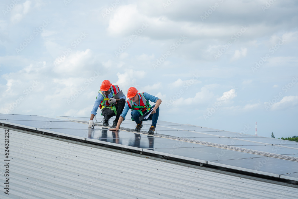 Technician wearing safety harness belt during installing the solar ...