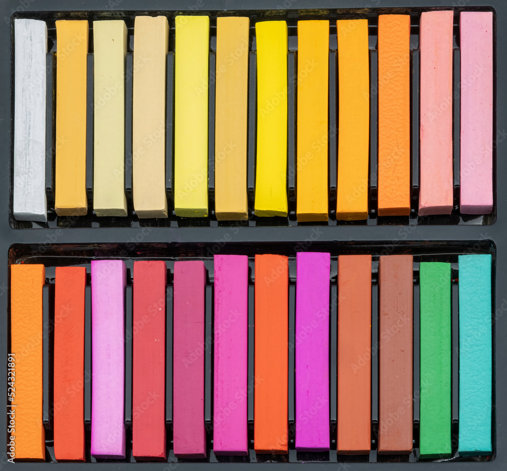 A box of pastel chalks - many different, intense colours in a pastel ...
