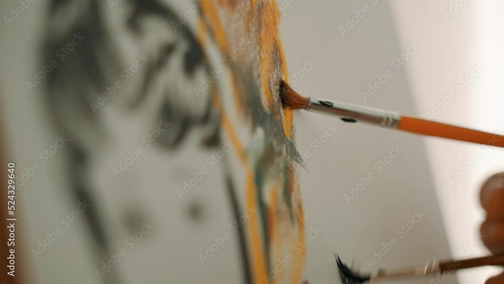 Drawing with two hands. A couple is drawing a picture. A man and woman ...