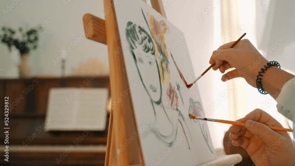 Drawing with two hands. A couple is drawing a picture. A man and woman ...