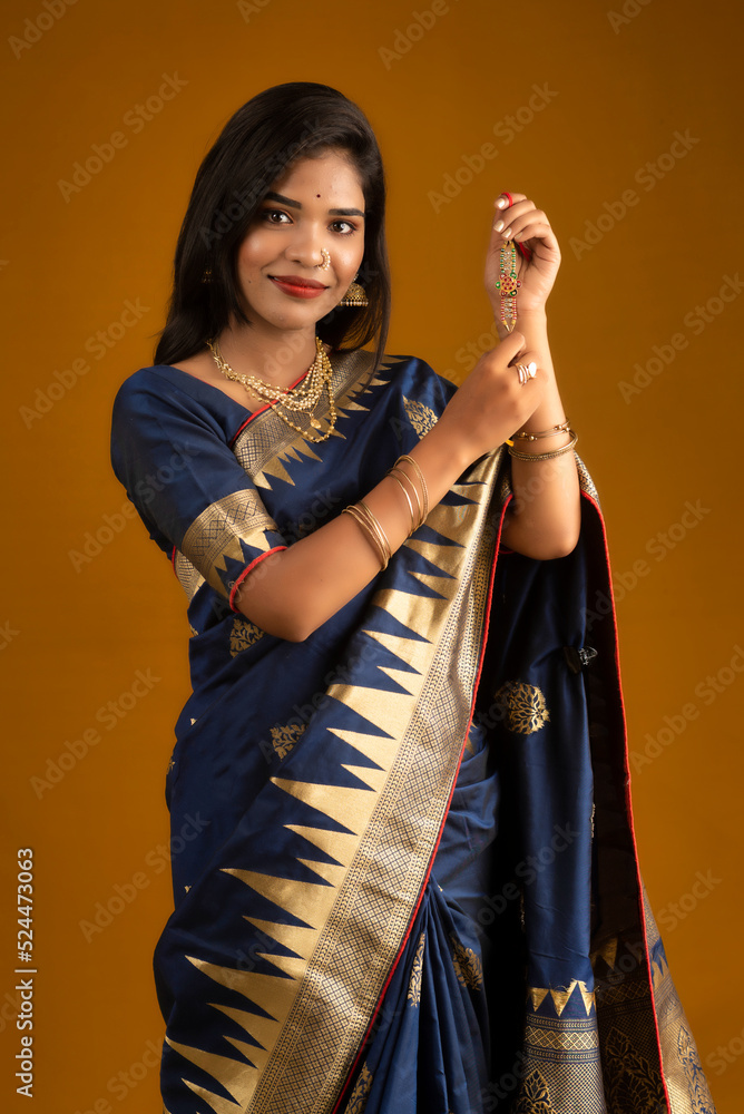 Beautiful Indian girl showing Rakhis on the occasion of Raksha Bandhan ...