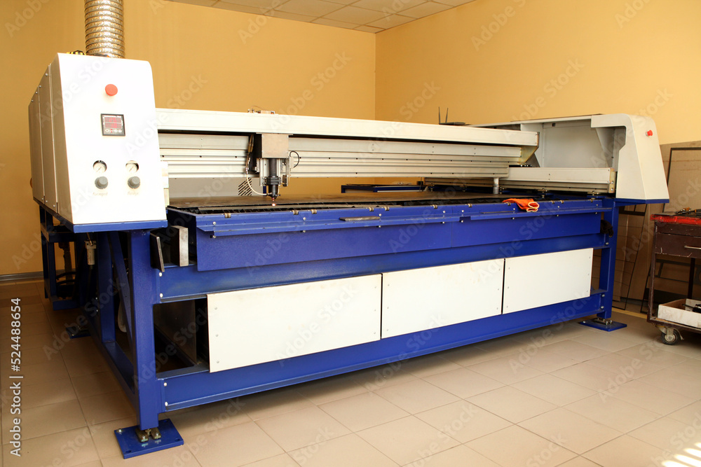 Plasma cutting CNC machine cuts metal material with sparks, industry ...