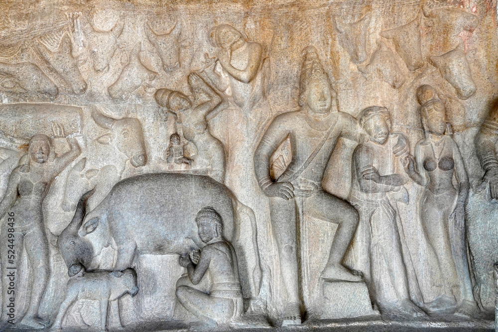 Human rock relief sculptures carved in the rock cut ancient cave temple in Mahabalipuram ...