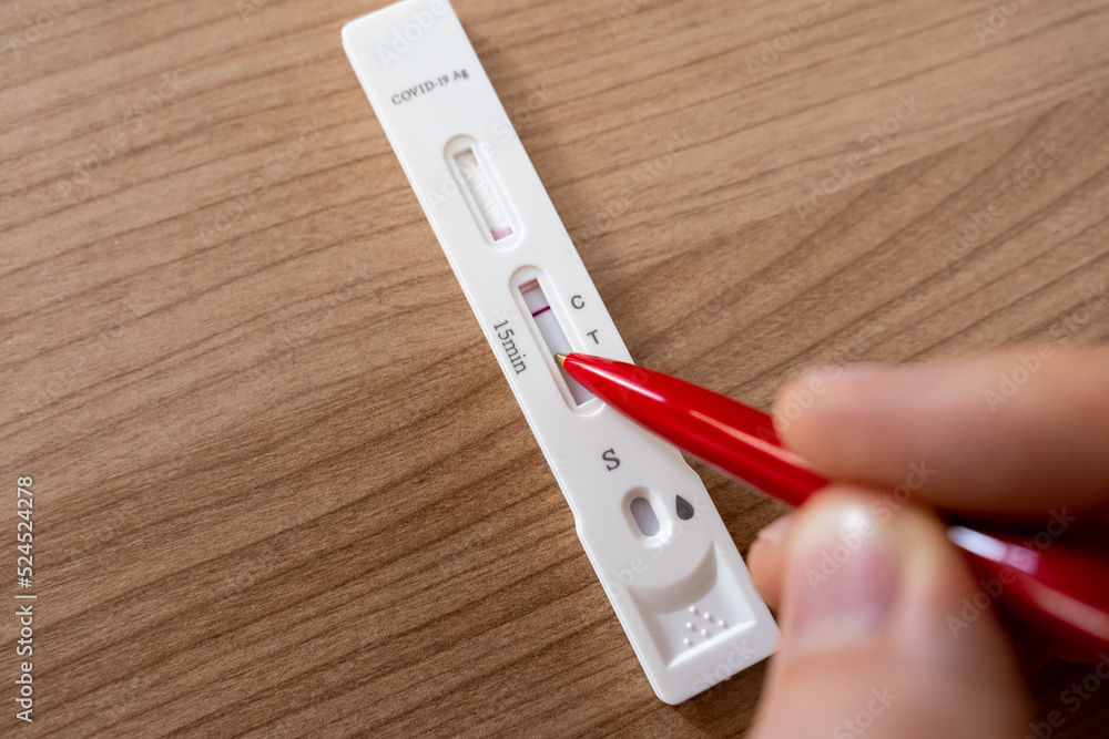 Faking a negative Covid antigen test to make it positive. Drawing a ...