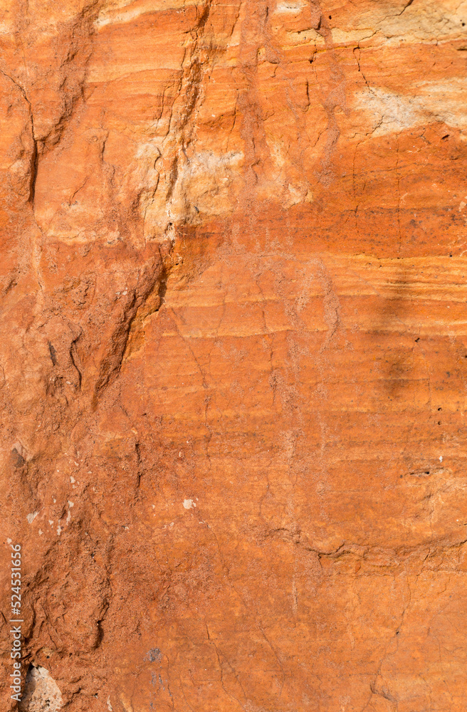 Sedimentary rocks with a high content of iron oxide. Red soil, loam ...