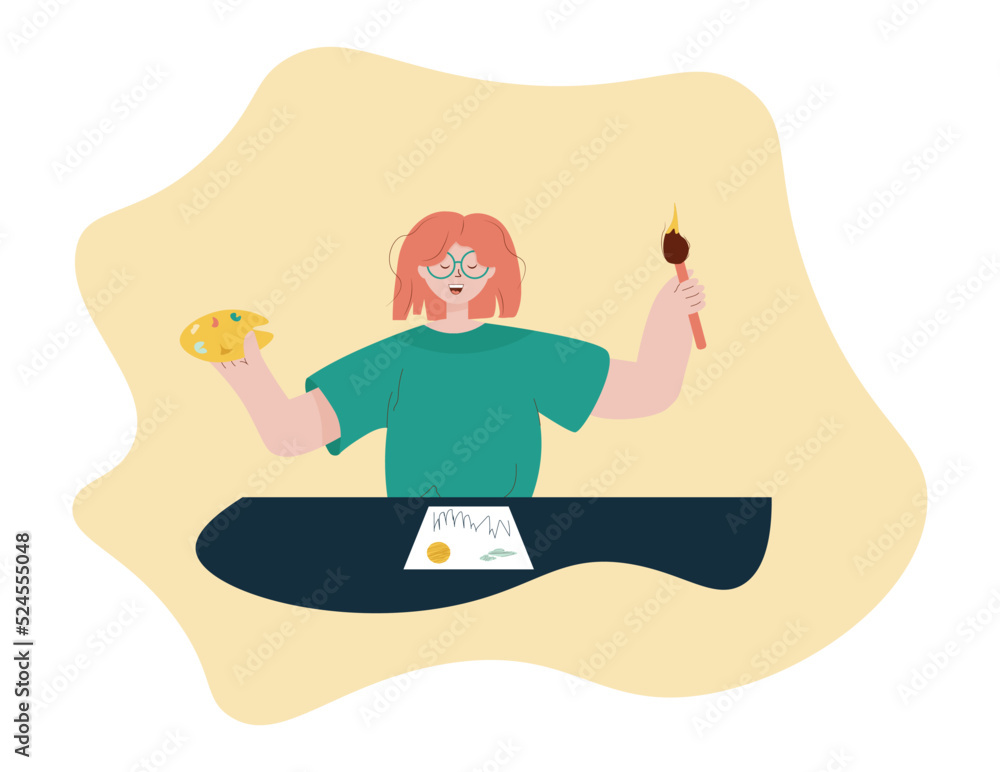 The girl is sitting at the table drawing with inspiration. The concept ...