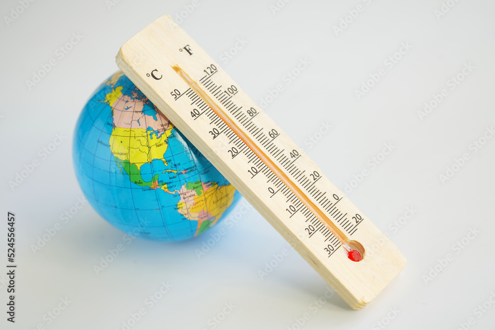 Globe and wooden eco-friendly thermometer on a white background ...