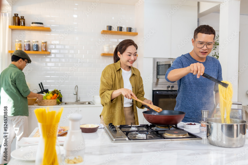 Group of Cheerful Asian man and woman enjoy cooking and talking ...