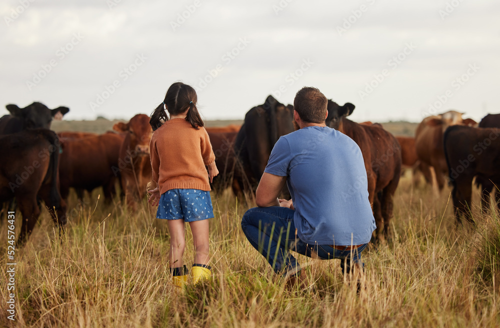 Foto de Father and daughter bonding at a cattle farm, having fun and ...