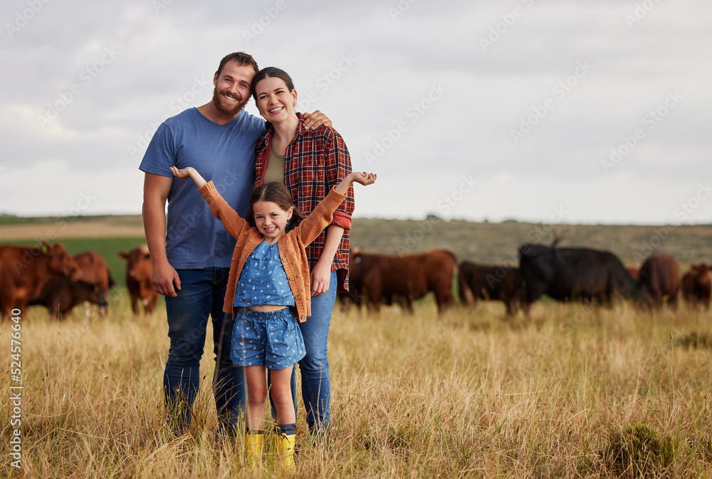 Happy family standing on a farm, cow in background and with a vision ...