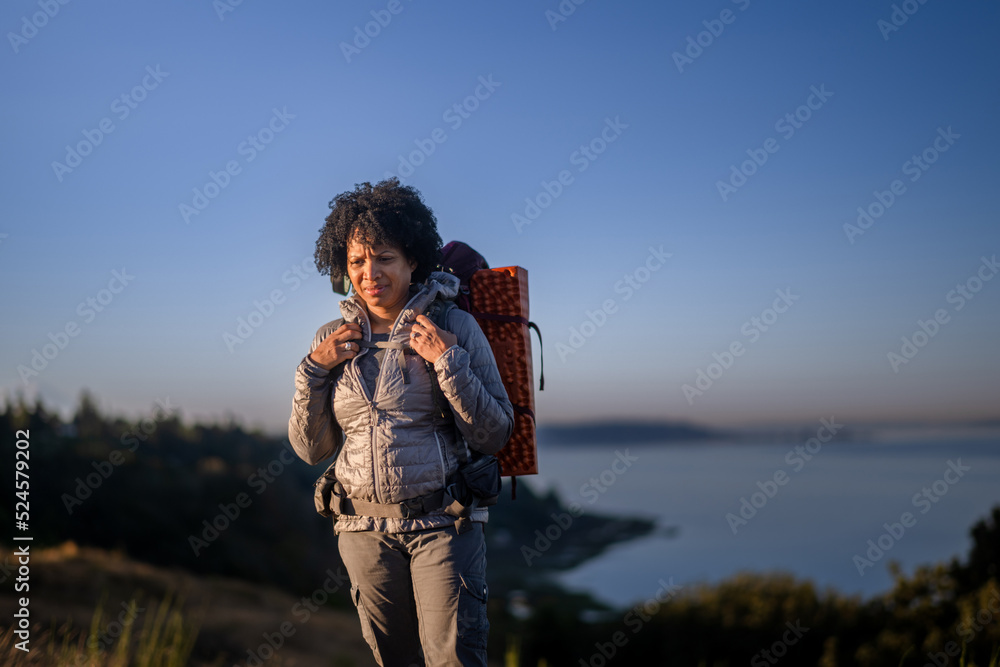 U.S. Army female soldier putting in the miles with an early morning ...
