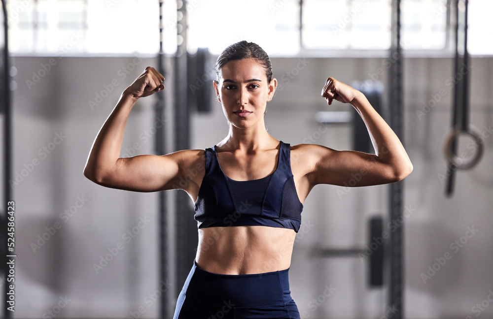 Gym, fitness and woman flexing muscles with energy to show off her ...