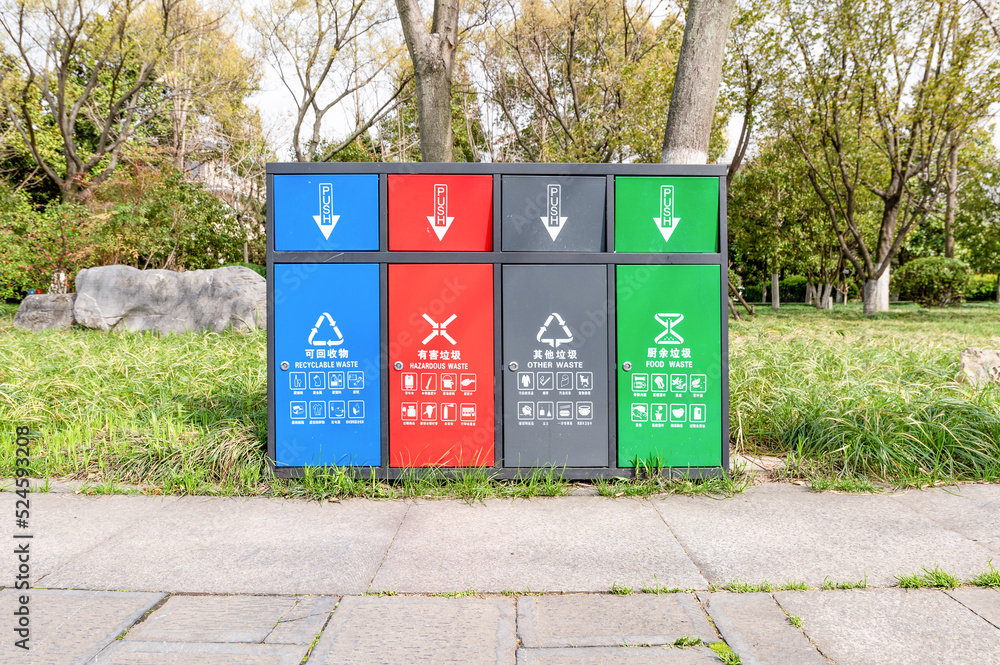 Four trash cans with symbols of waste sorting, sustainable development ...