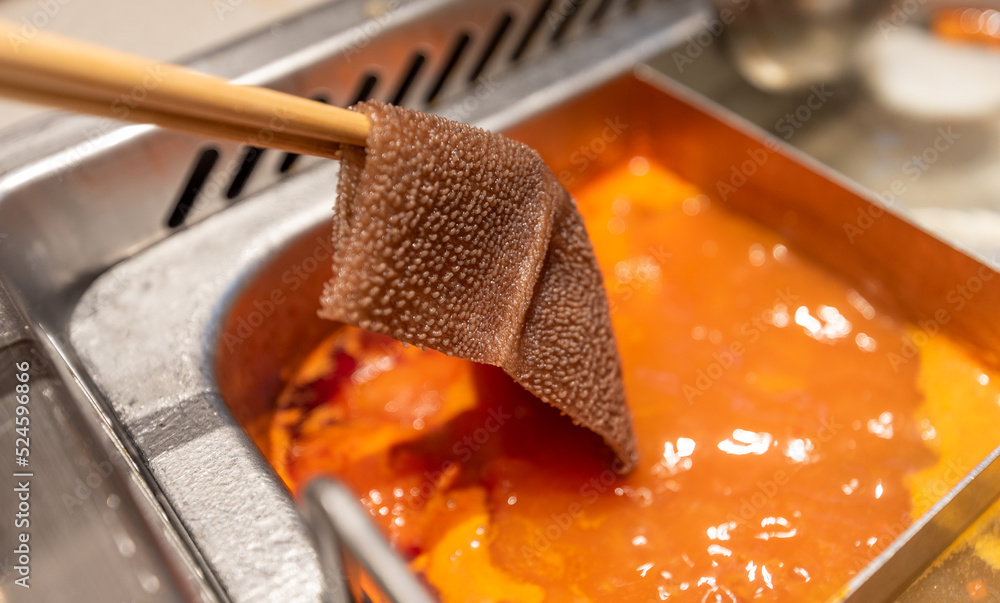 Traditional Chinese hot pot ingredients on a plate - Maodu (cow's ...