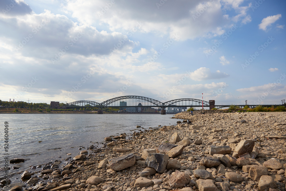 dry shore of rhine river in Cologne at extremly low tide, caused by ...