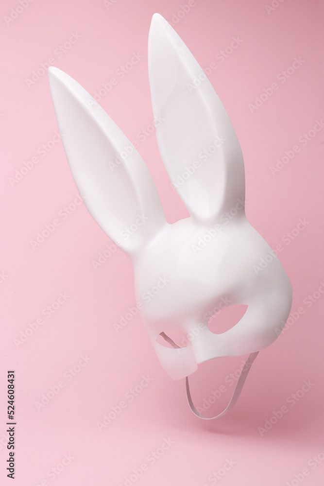 Sexy white rabbit mask with long ears flying in antigravity on pink ...
