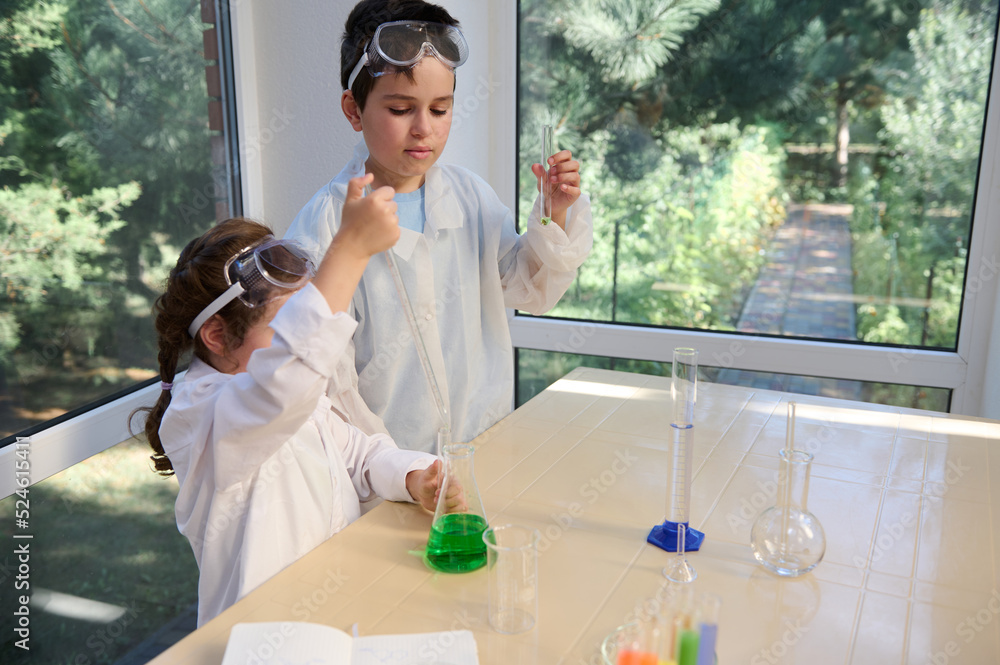 Science children education in chemistry lab. Primary school students ...