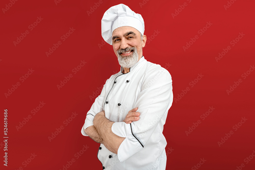 Chef-cooker in a chef's hat and jacket. Senior professional baker man ...