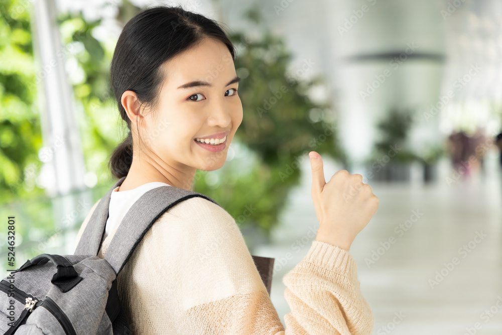 Excited and successful asian woman college student getting back to ...