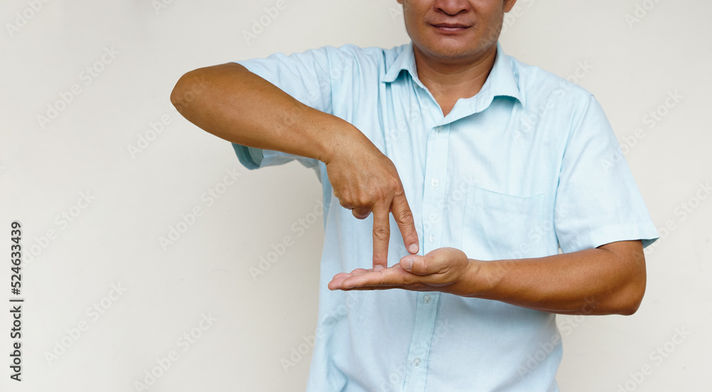 Fotka „Asian man teacher demonstrate body sign language. Two fingers ...