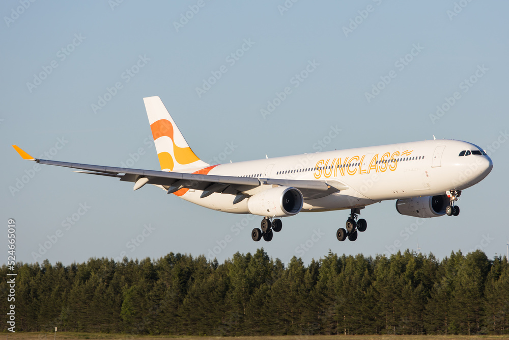 A Sunclass Airbus A330 Widebody jet landing in Oslo coming from a sunny ...