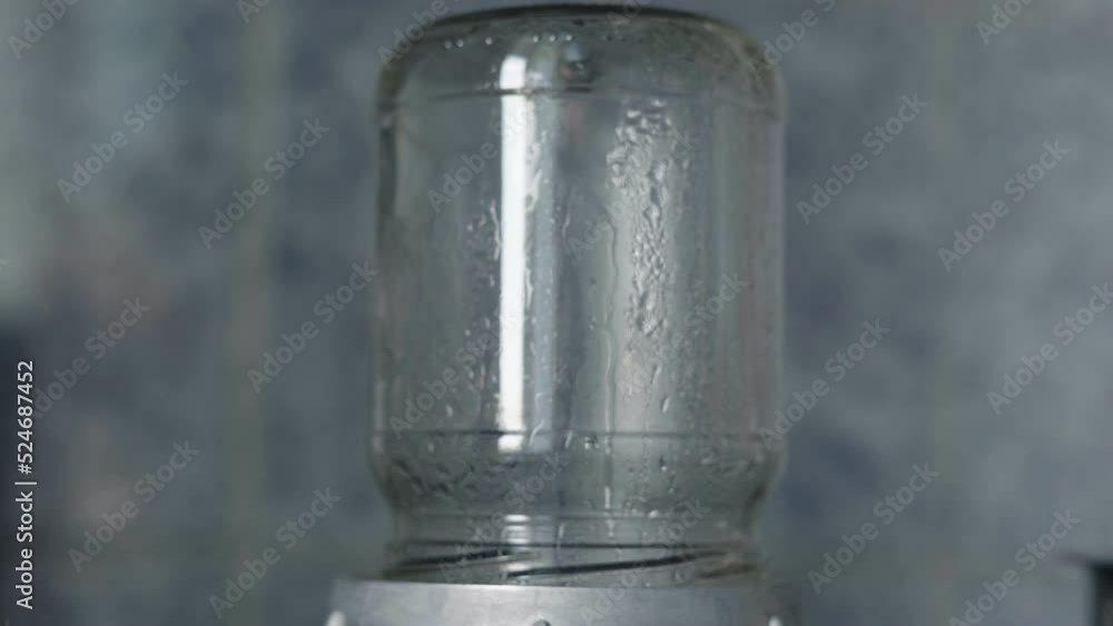 Close-up, condensate droplets drain from the inside of the can ...