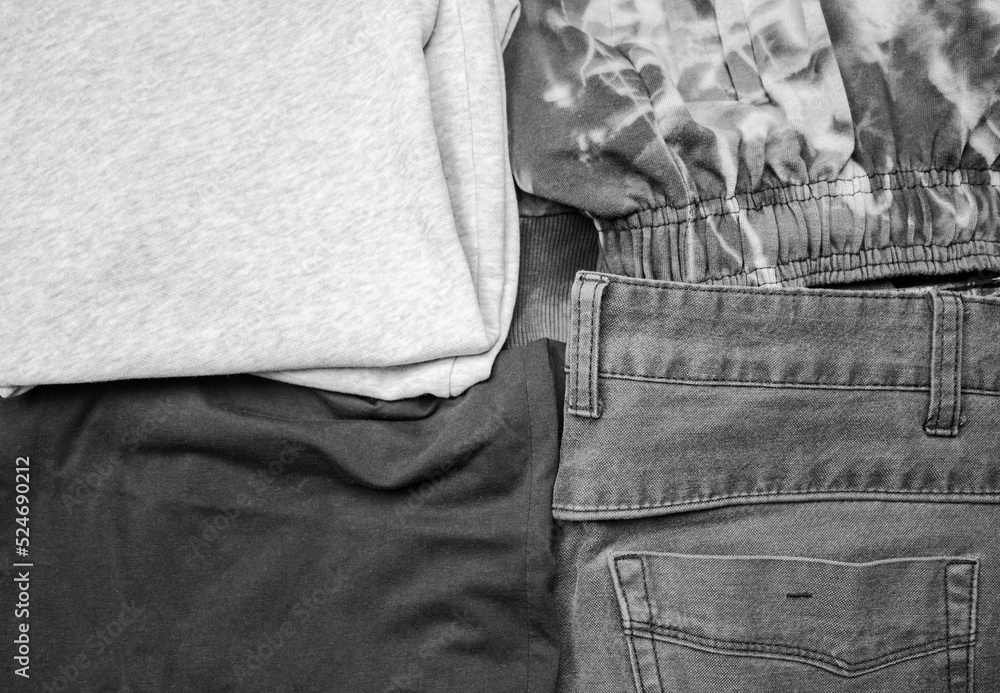 Clothes colorless in a wooden box. Clothes in a drawer. Folded clothes ...