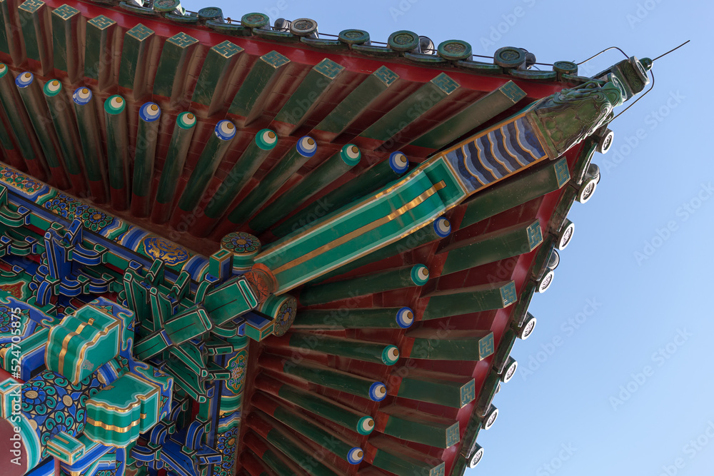 Colourful overhanging roof eaves structure supported by colourful roof ...