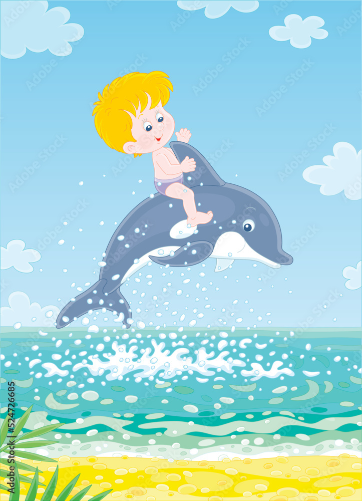 Happy little boy riding a merry playful dolphin in blue water of a ...