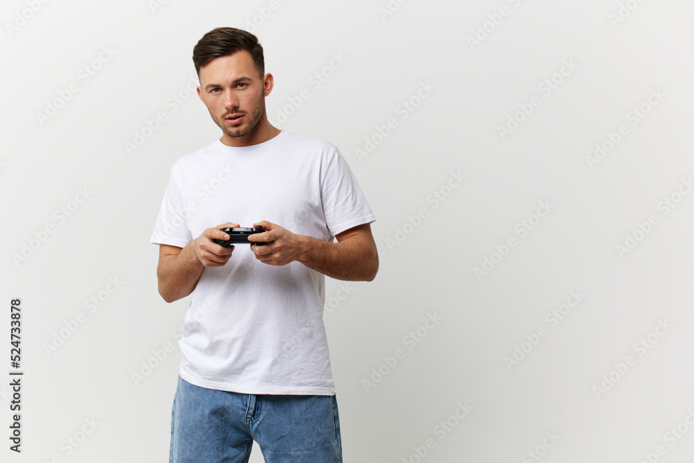 Passionate happy tanned handsome man in basic t-shirt play active ...