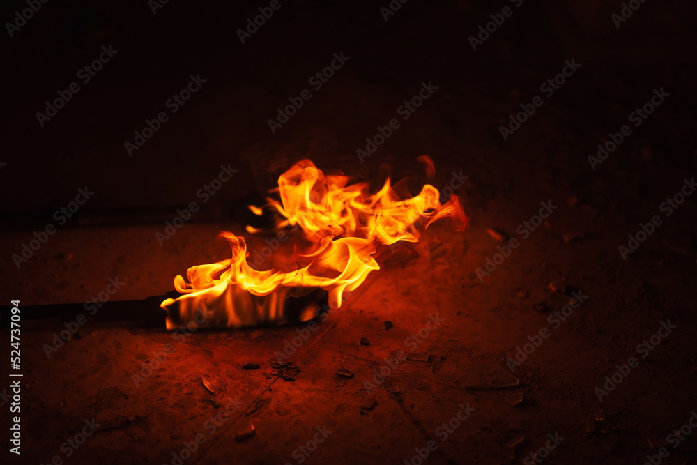 orange fire from an iron torch. Burning kerosene on a cane rag. burning ...