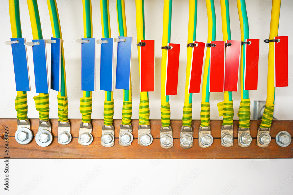 Electrical high voltage ground copper cables on wall. Grounding ...