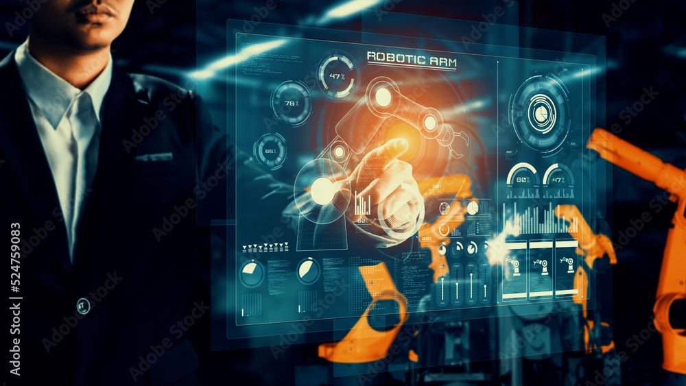 Engineer use cybernated robotic software to control industry robot arm ...