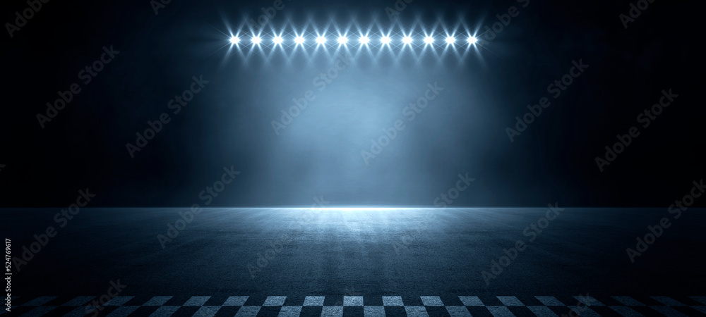 Racing finish line on asphalt ground with dark blue shining spotlights ...