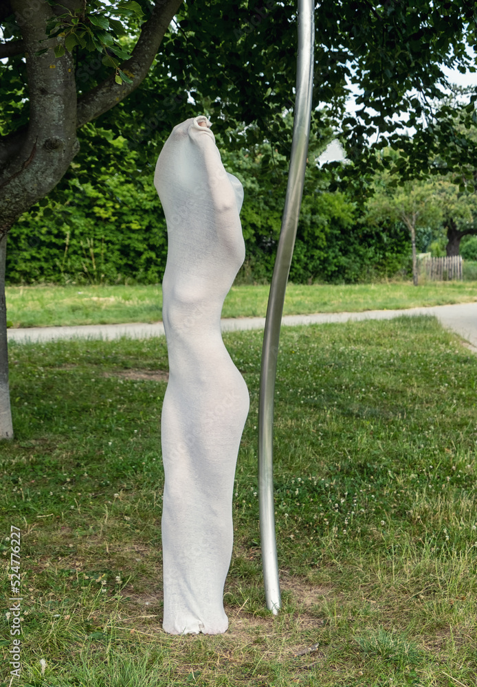 young sexy elegant woman, her body wrapped in long skin tight white ...
