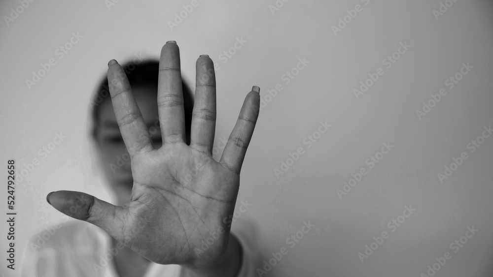 Stop hurting woman! young female person raised her hand for stop ...