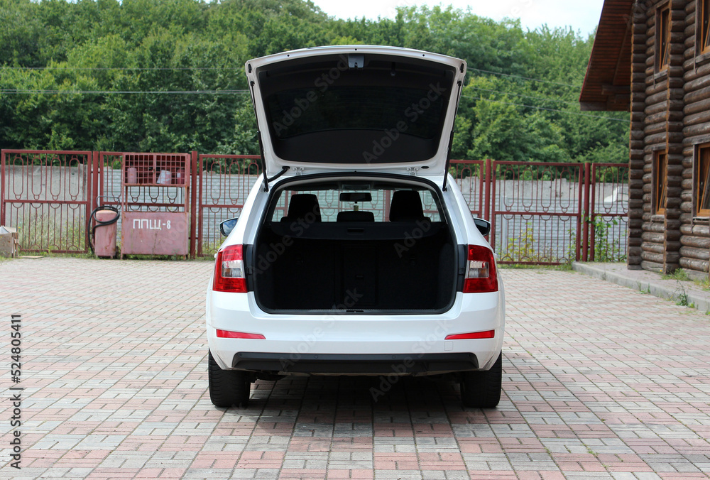 White modern car with open empty trunk. Modern wagon car open trunk ...