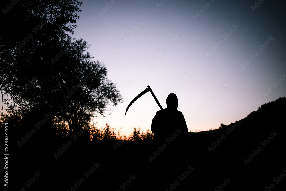 grim reaper, the death itself, scary horror shot of Grim Reaper holding ...