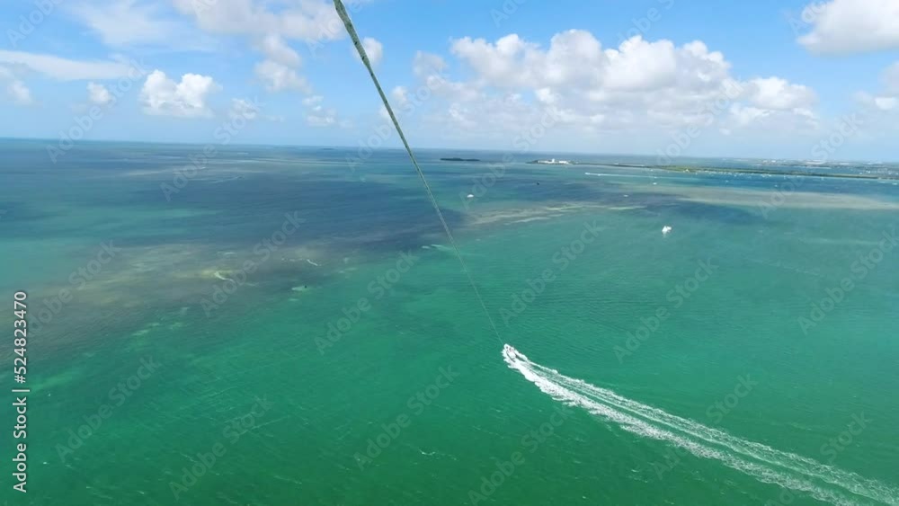 Parasail b roll of sky from 2 people Parasailing with green and blue ...