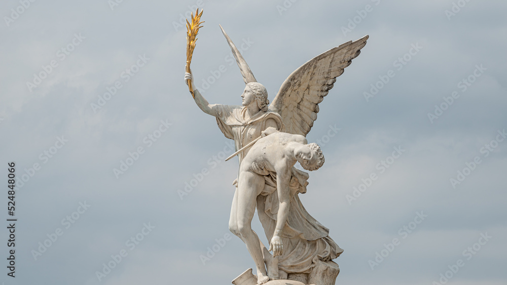 Banner with Roman statue of an angel holding a fighter at war at ...