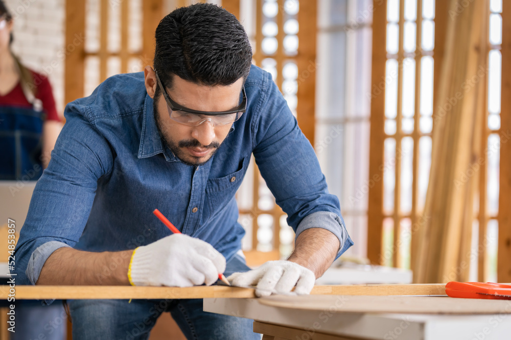 Smart and good looking Asian male carpenter. I am designing furniture ...