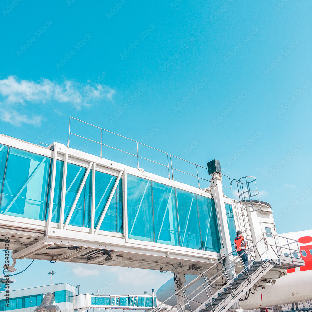 aerobridge or airbridge is an elevated corridor connecting an airport ...