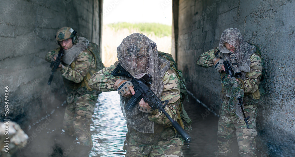 Covert entry into an enemy bunker - three mercenary soldiers walk ...